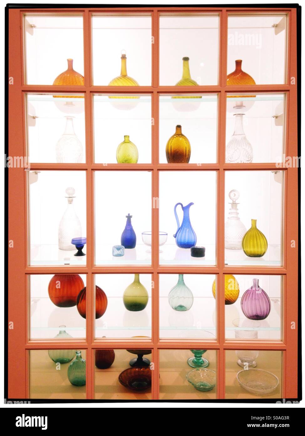 A cabinet full of colorful glass objects Stock Photo - Alamy