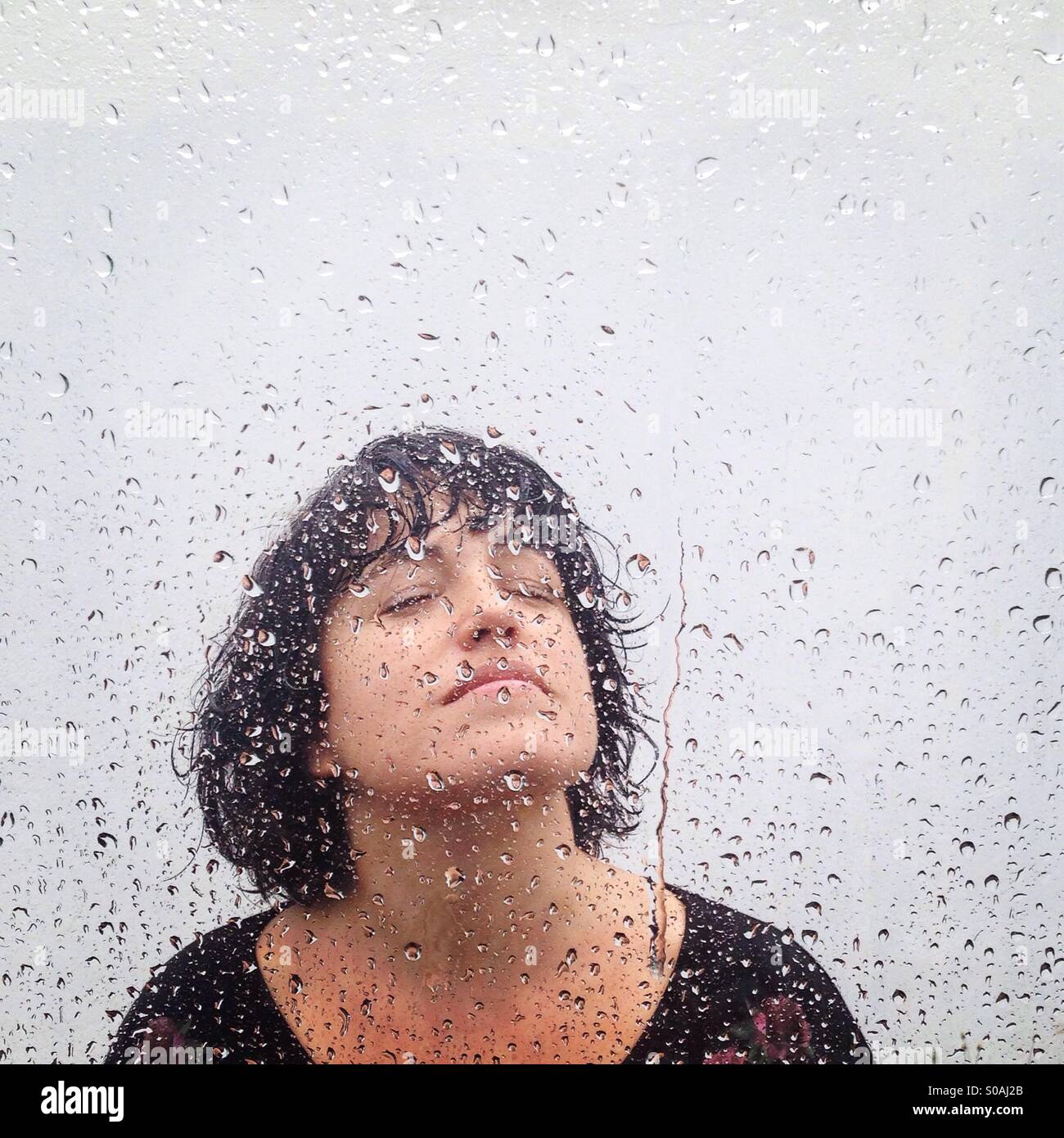 Woman under the rain hi-res stock photography and images - Alamy