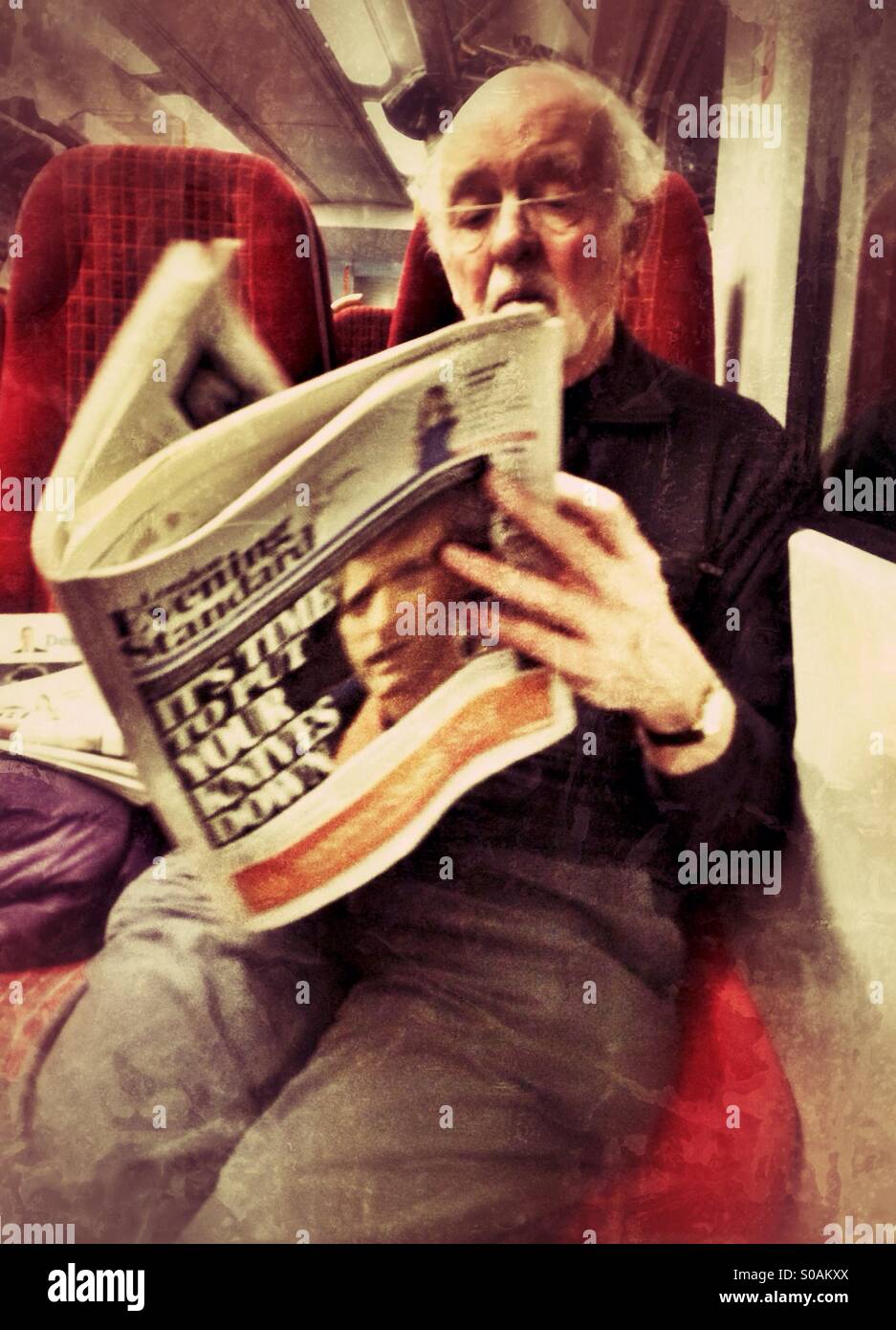 Man Train Reading Newspaper High Resolution Stock Photography and ...