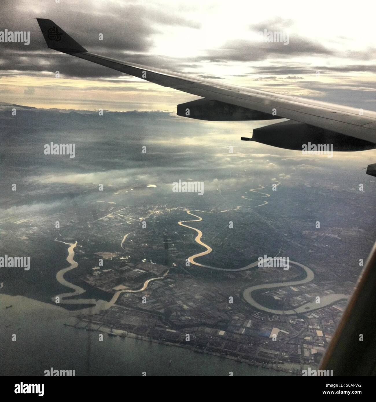 Looking out the window of airplane as it flys over Kuala Lumpur ...
