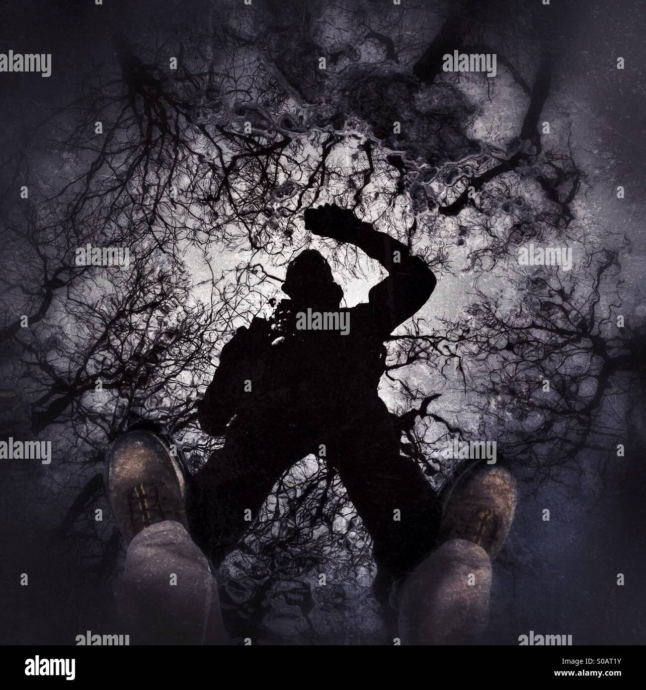 Selfie of photographer reflected in puddle Stock Photo - Alamy