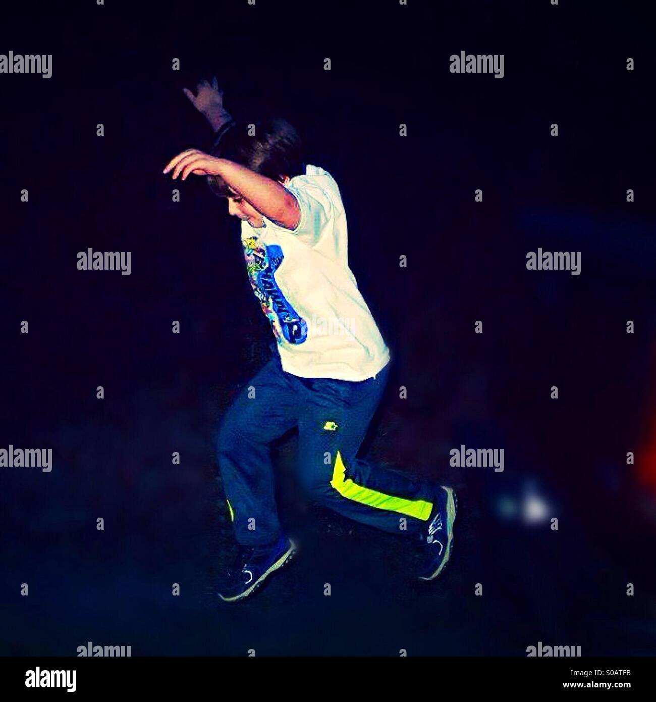 A boy leaping Stock Photo - Alamy