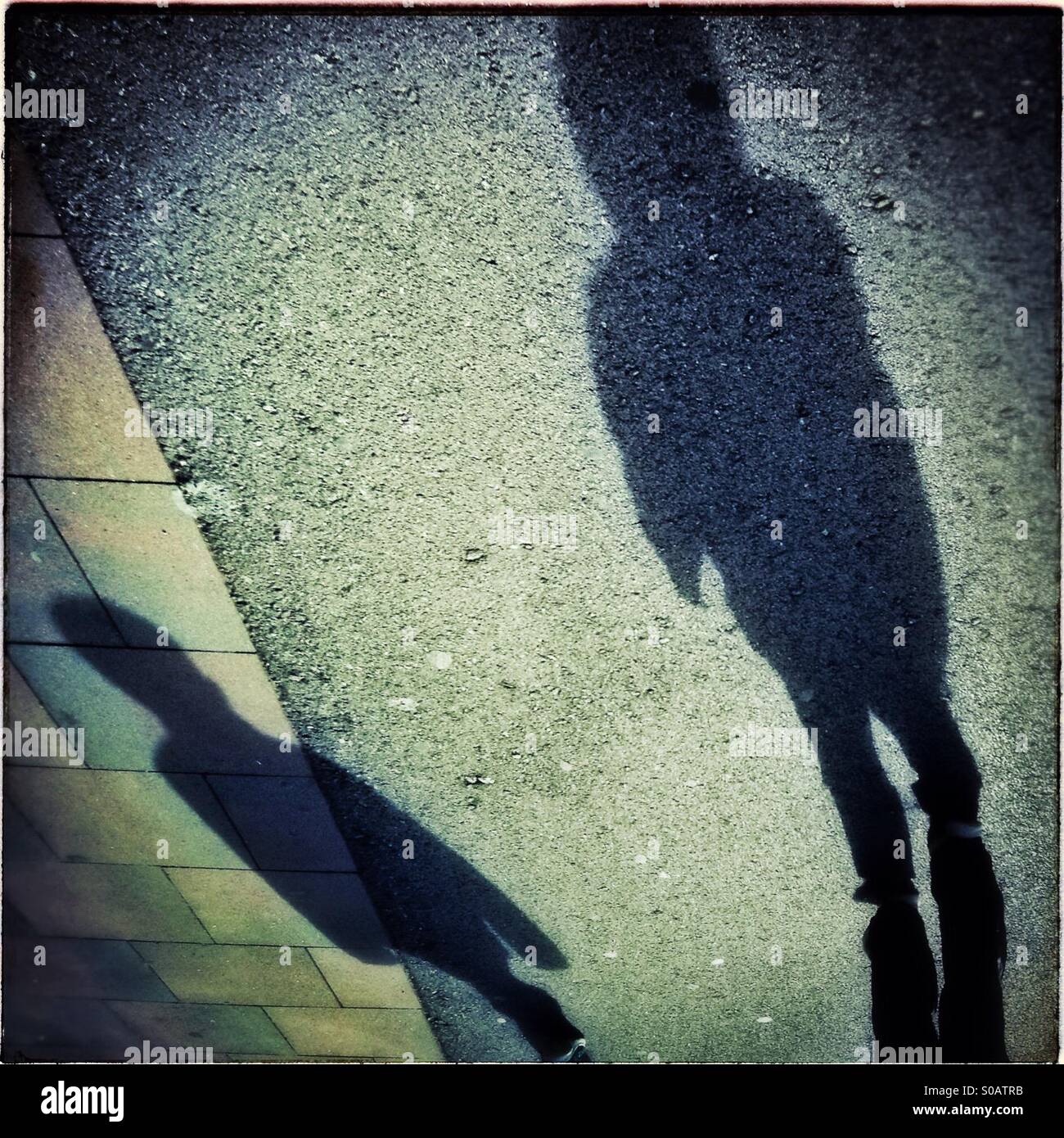 Urban street pedestrian shadows smartphone stock photos and images - Alamy
