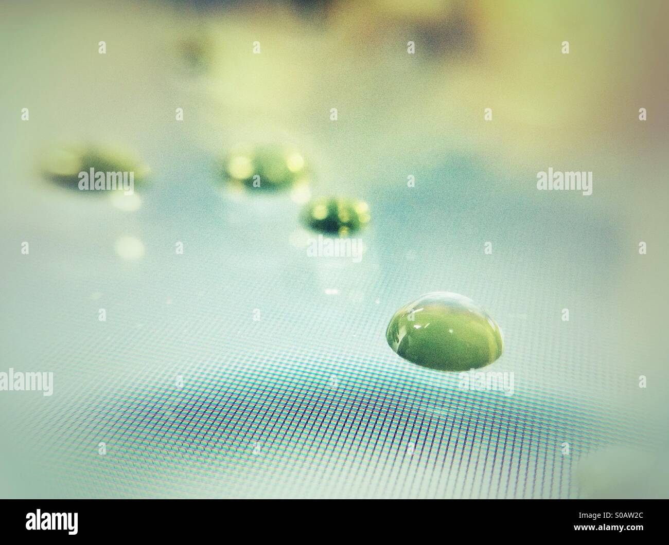Water drops on a surface of electronic tablet Stock Photo - Alamy