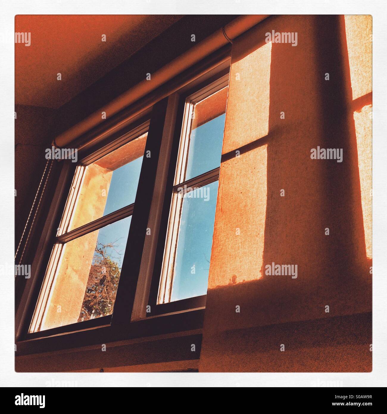 Sunlight streaming in through a window Stock Photo - Alamy