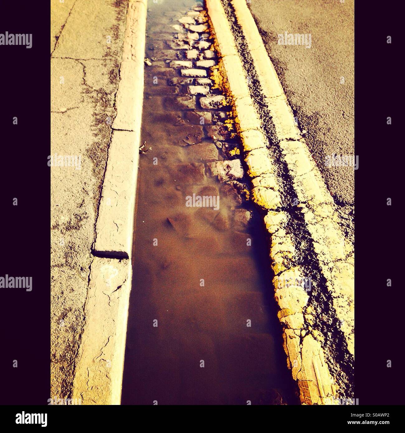 Parallel road lines and puddle Stock Photo - Alamy