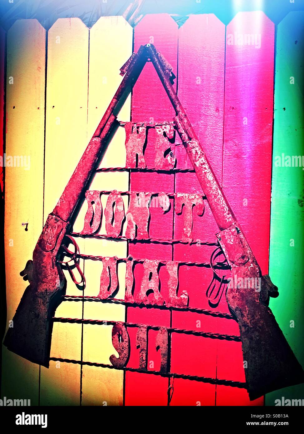 "We don't dial 911" with crossed rifle sign Stock Photo - Alamy