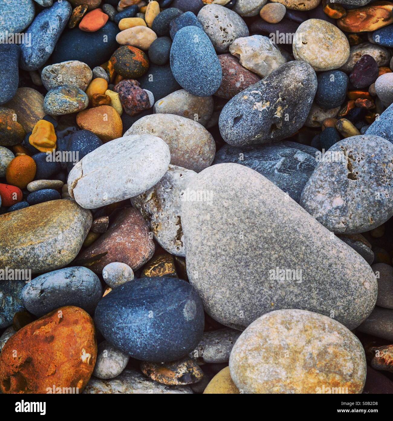Colourful seaside pebbles background Stock Photo - Alamy