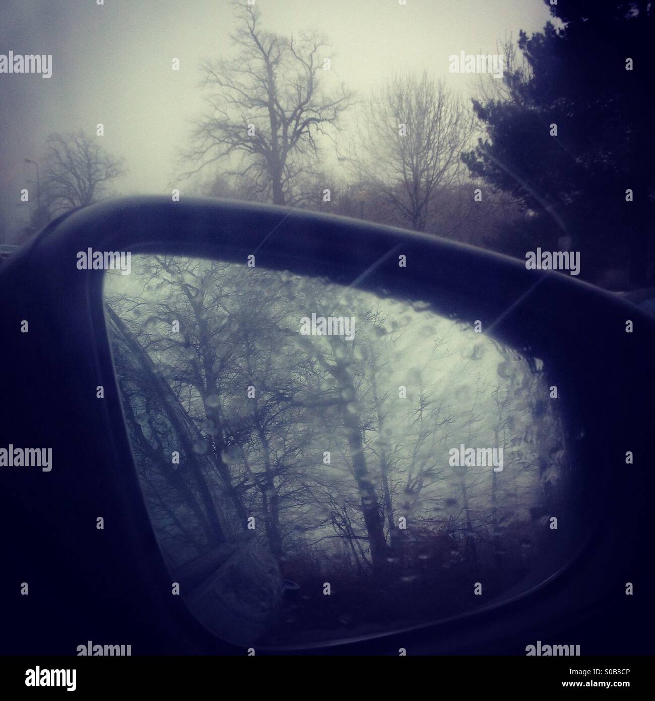 Misty rainy day through car window Stock Photo - Alamy