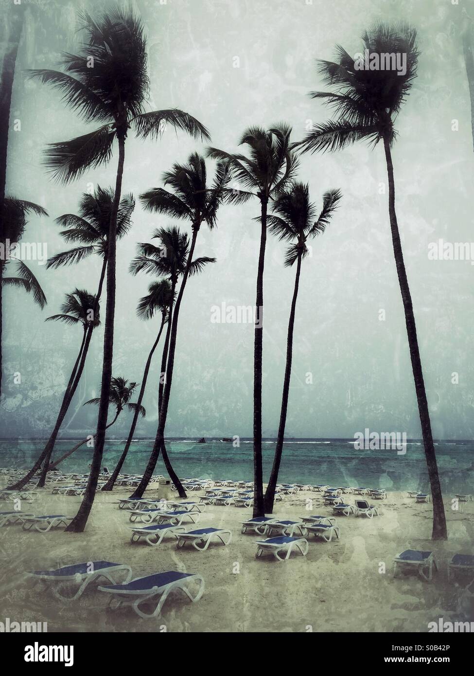 A tropical beach resort, empty on a stormy day Stock Photo - Alamy