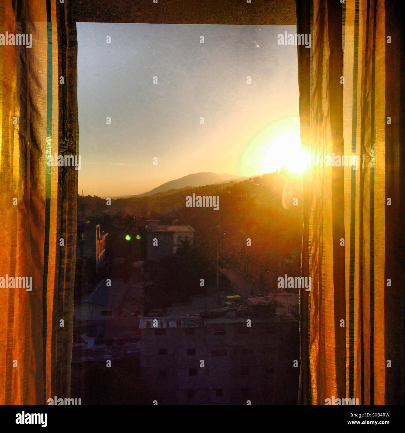 Sunrise through a window in Port Au Prince, Haiti Stock Photo - Alamy