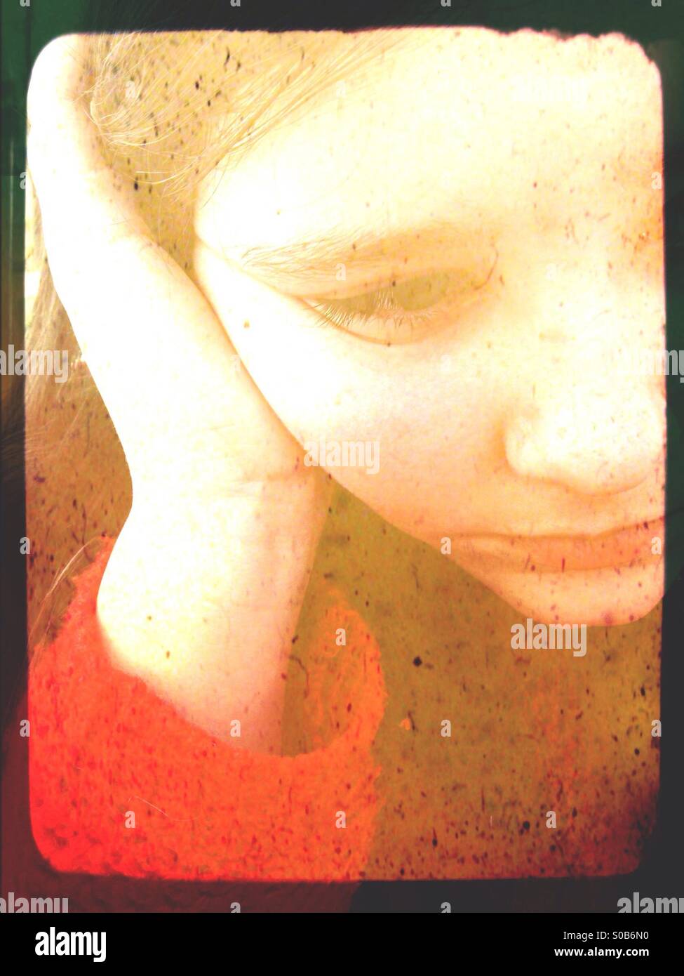 Young girl looking fed up and gloomy Stock Photo - Alamy