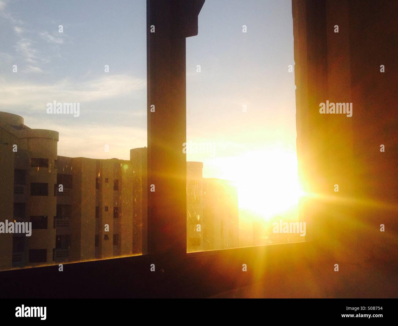 Sunset through the window Stock Photo - Alamy