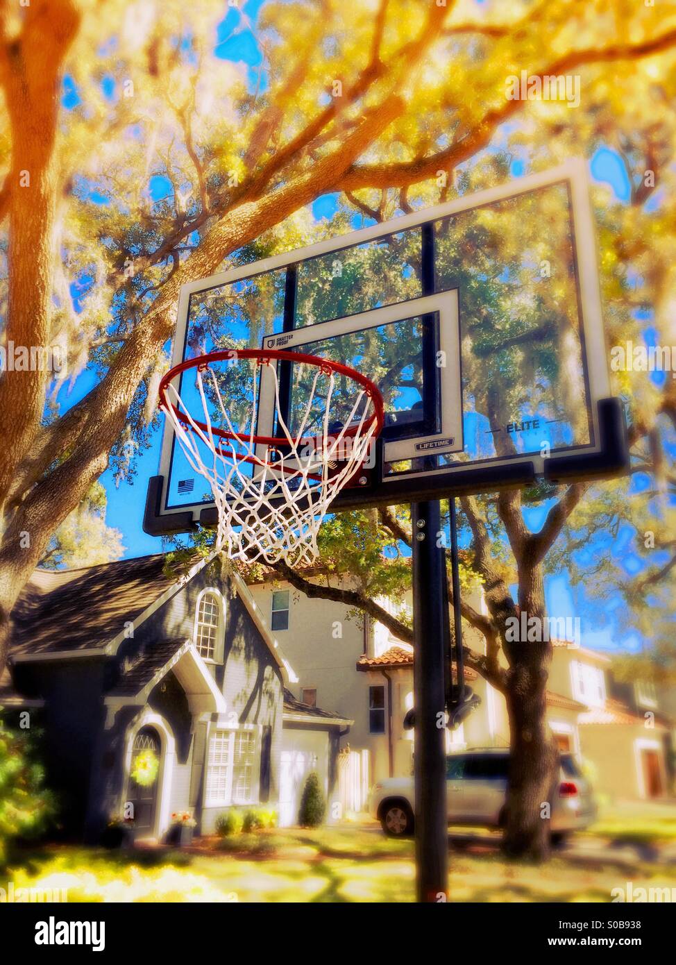 Basketball hoop in residential neighborhood Stock Photo - Alamy