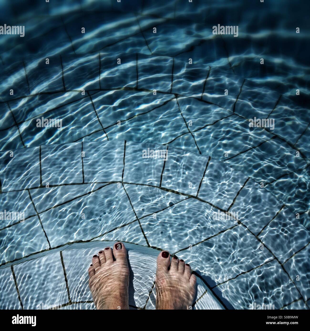 Dipping feet into water hi-res stock photography and images - Alamy