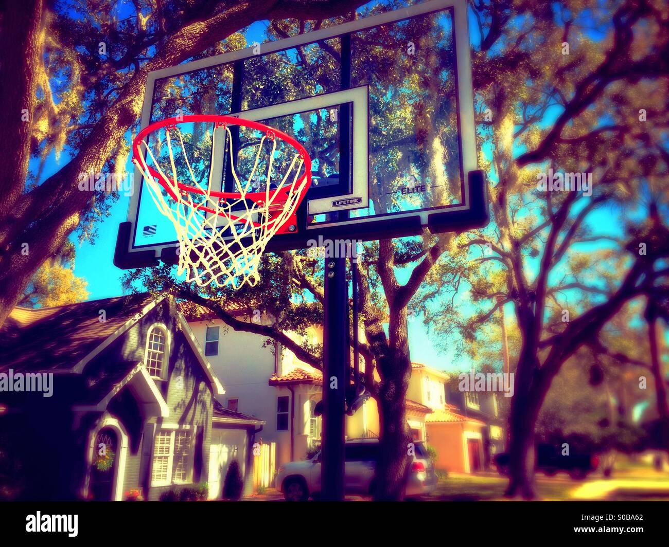 Basketball hoop in residential neighborhood Stock Photo - Alamy