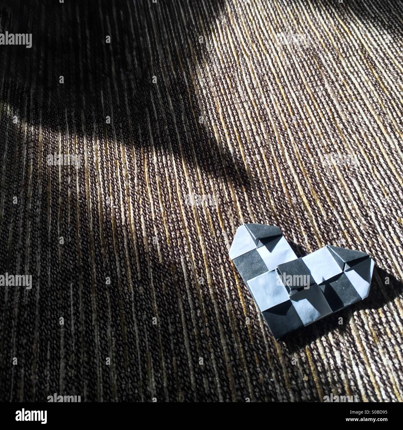 Cat shadow & checkered heart Stock Photo - Alamy