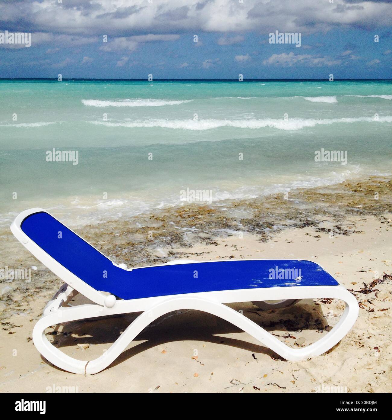 Chair on beach Stock Photo - Alamy