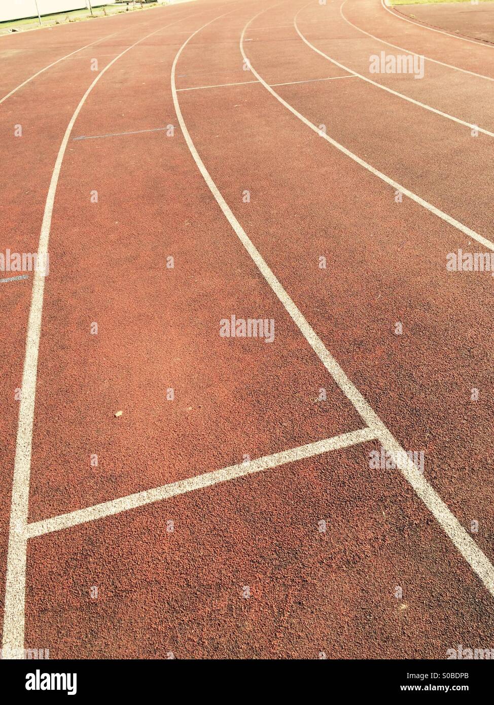 Lines on an athletics track Stock Photo - Alamy