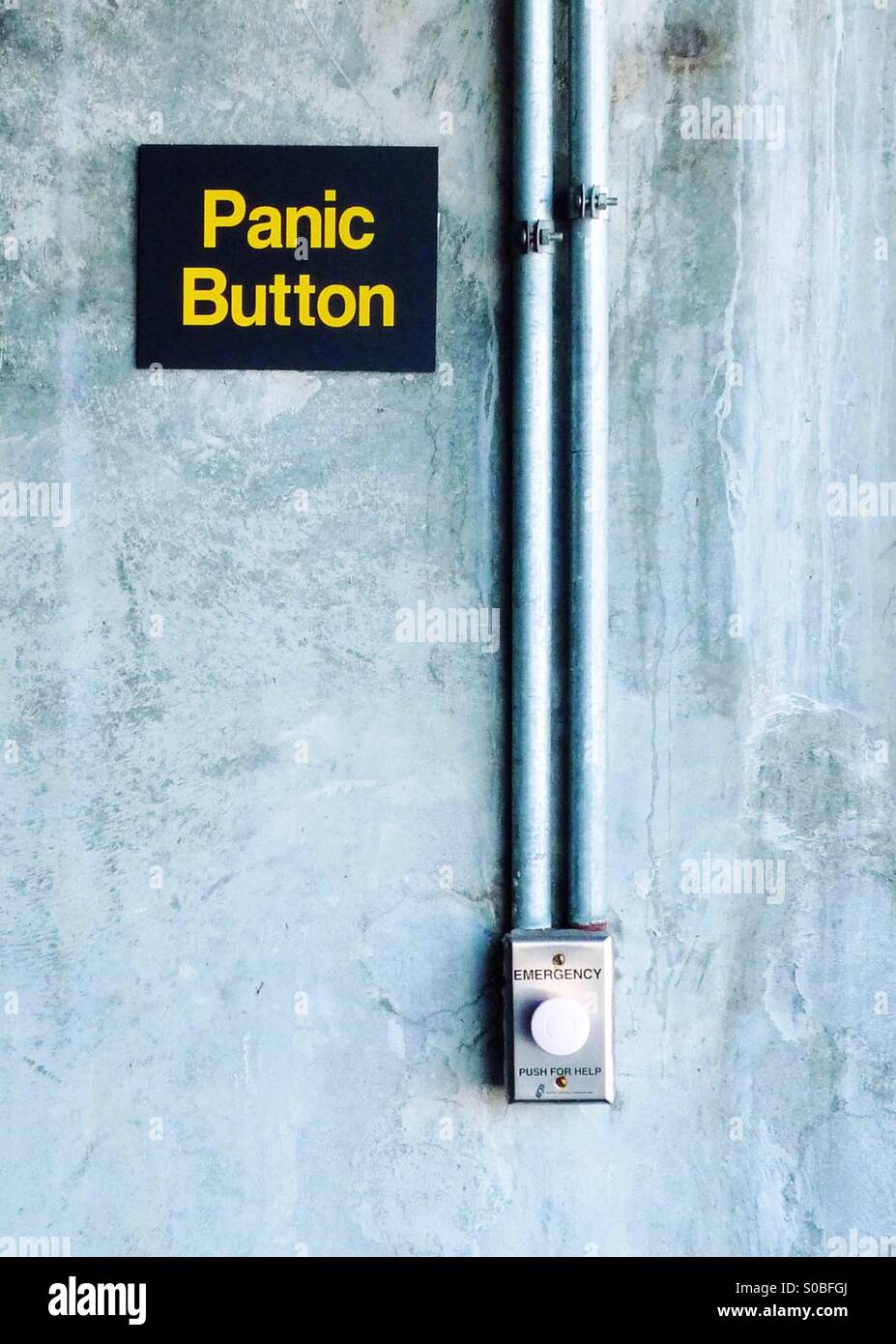 Panic button on industrial wall Stock Photo - Alamy