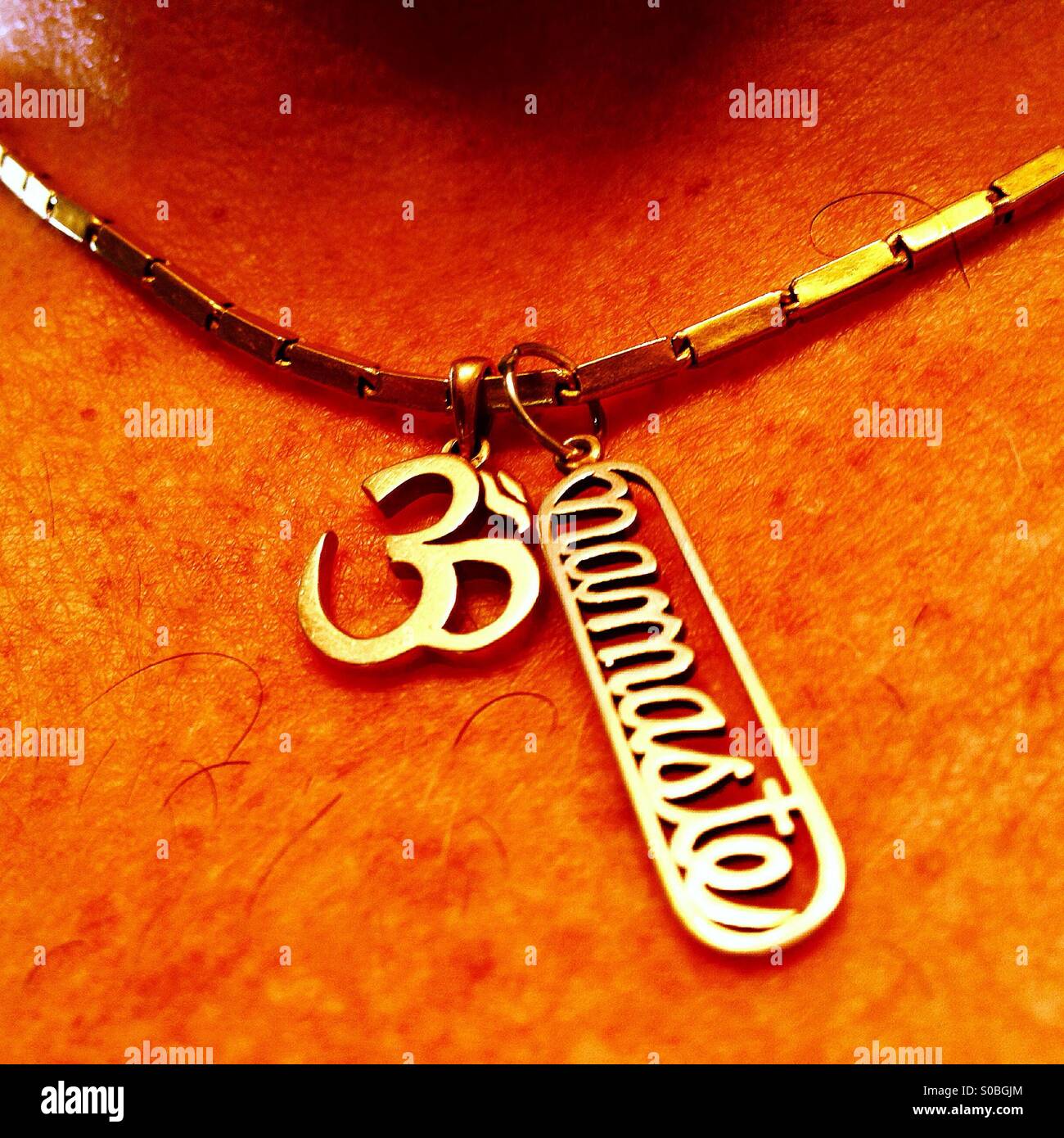 Gold Thai 22k necklace with gold Om, Namaste charm pendent on mans neck ...