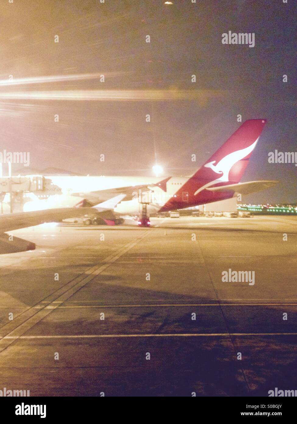 Night landing. Planes parked at Heathrow after dark Stock Photo - Alamy