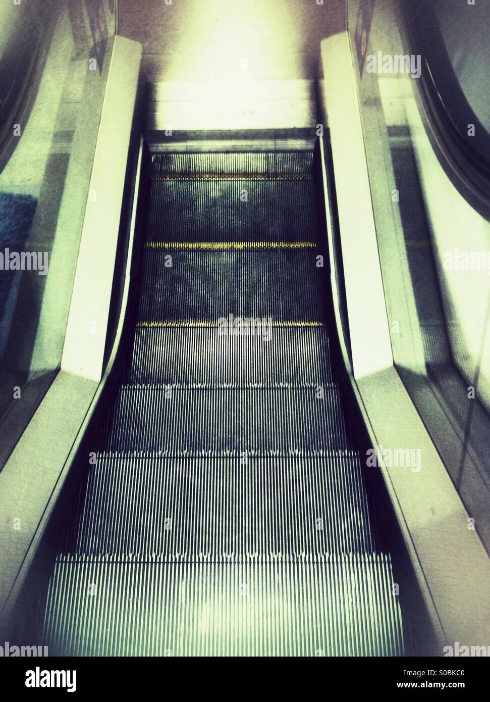 Looking down escalator in shop England UK Stock Photo - Alamy