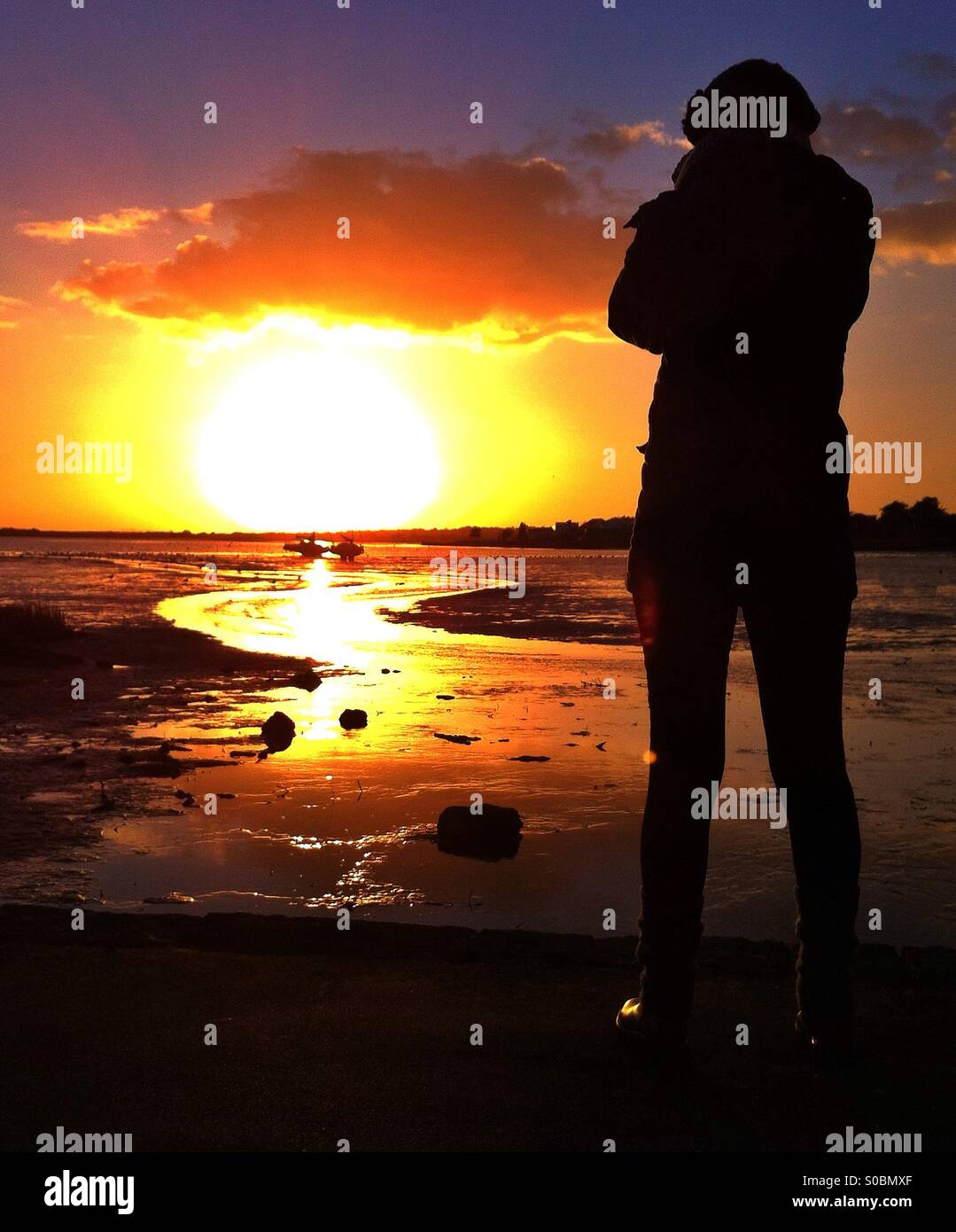 Watching the sunset Stock Photo - Alamy