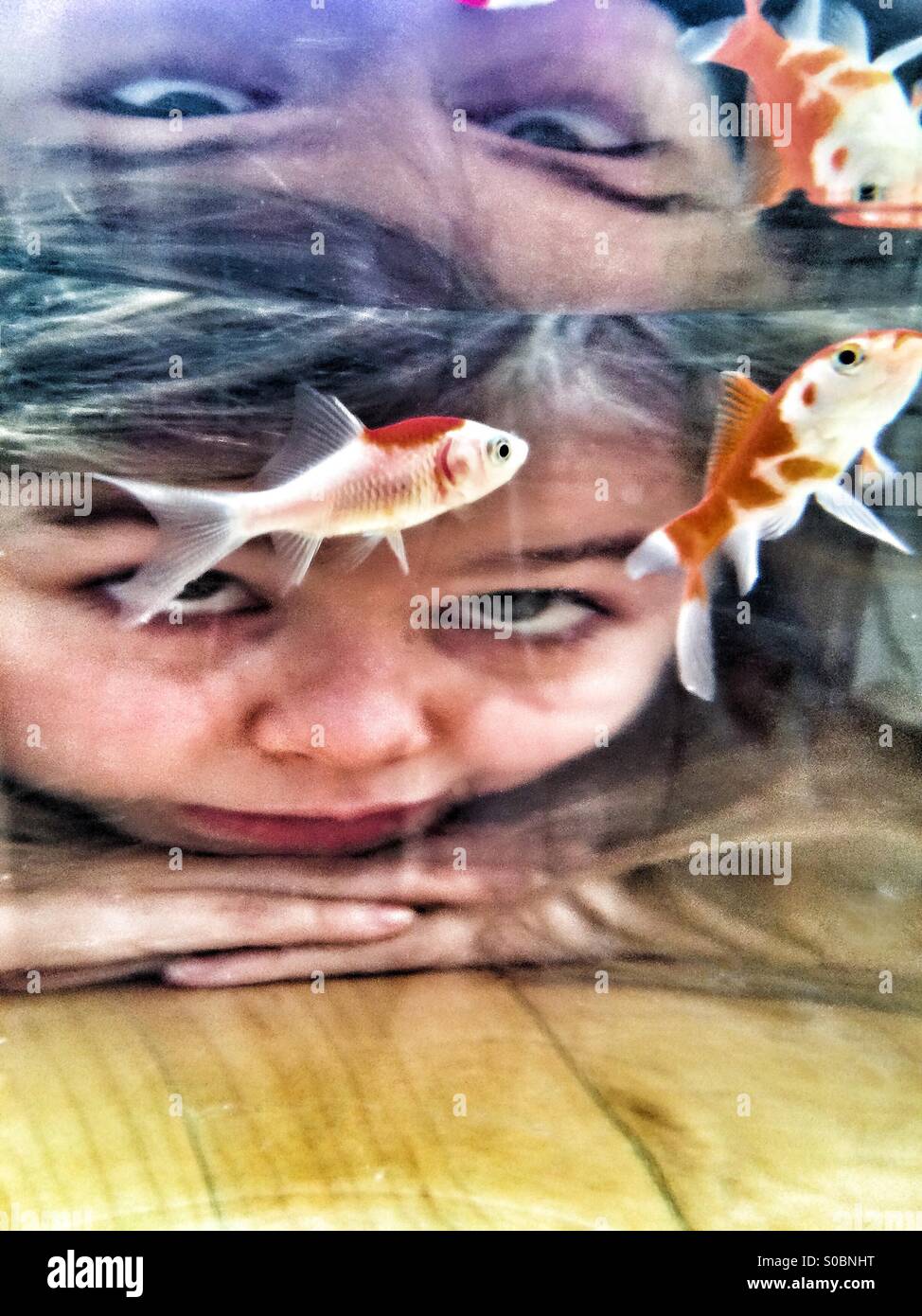 Girl with fish bowl hi-res stock photography and images - Alamy