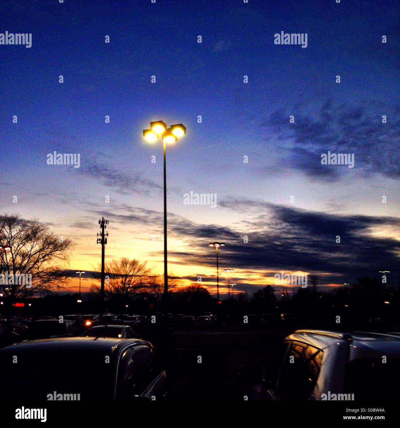 Parking lot sunset Stock Photo - Alamy