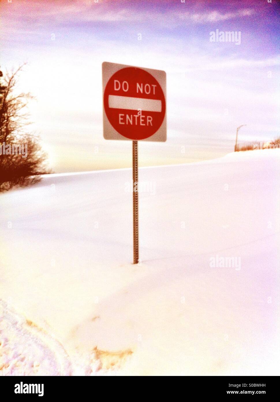 Do not enter sign in front of snow field Stock Photo - Alamy