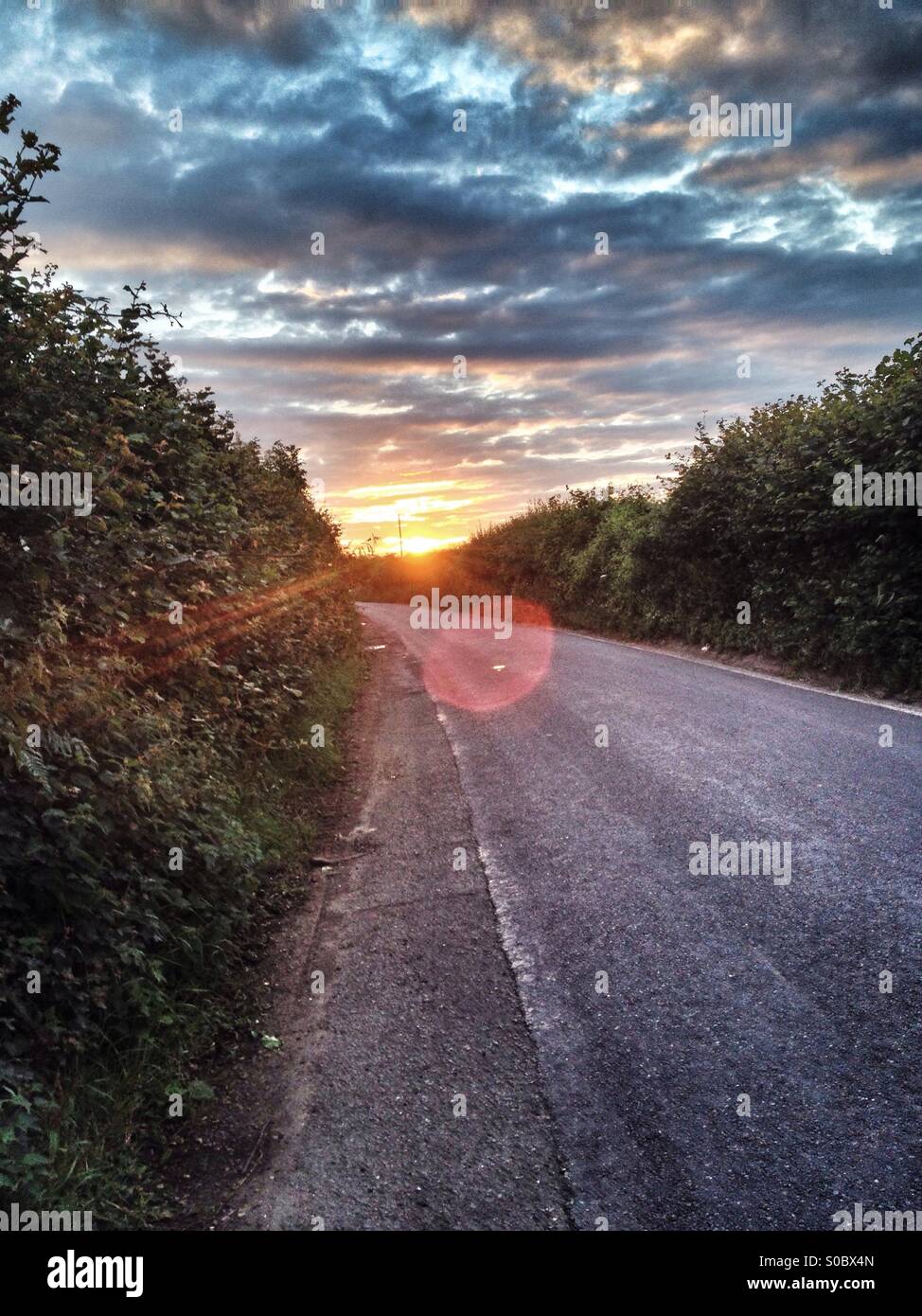 Empty road dramatic sunset hi-res stock photography and images - Alamy
