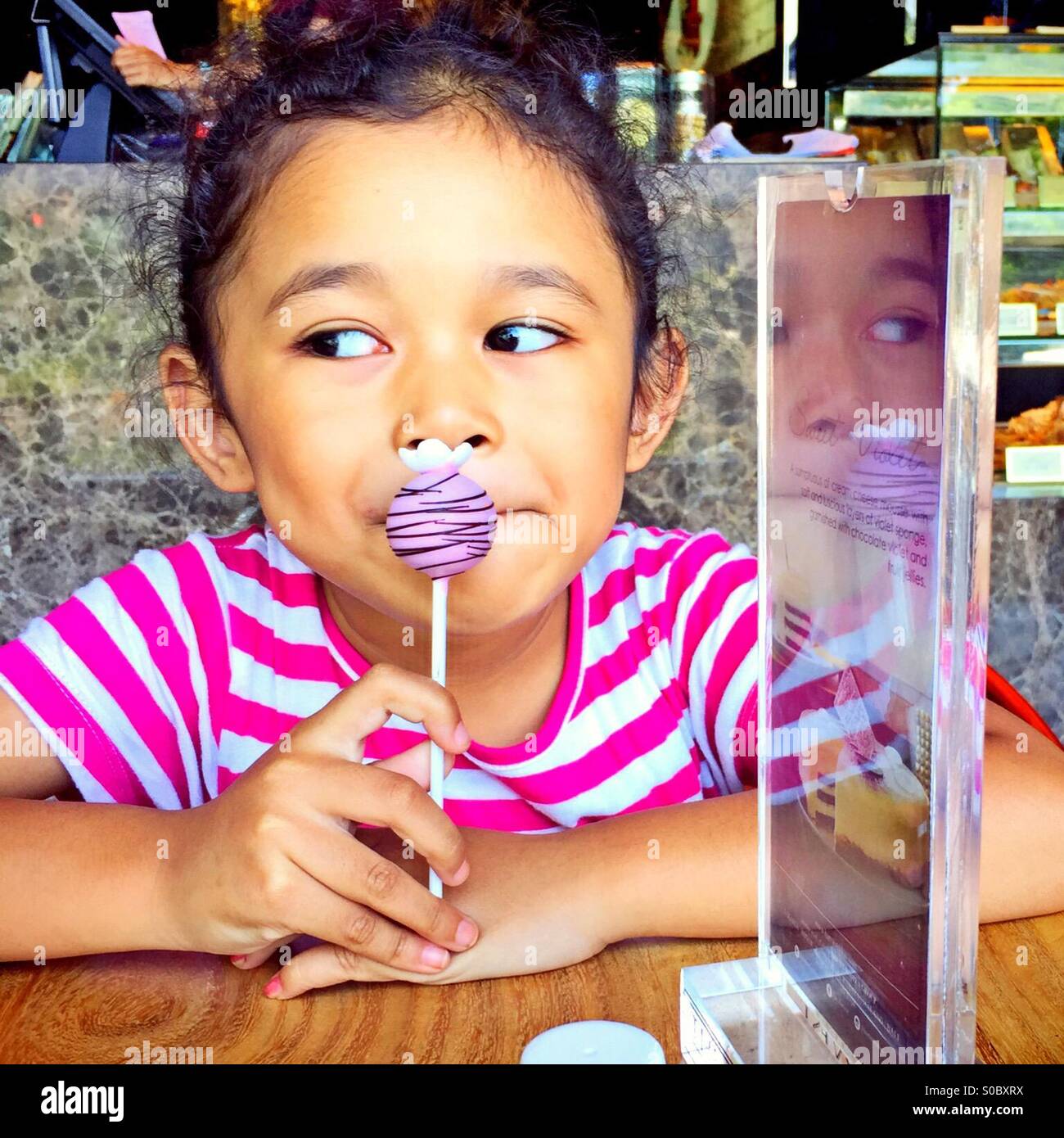 Girl with lolly hi-res stock photography and images - Alamy