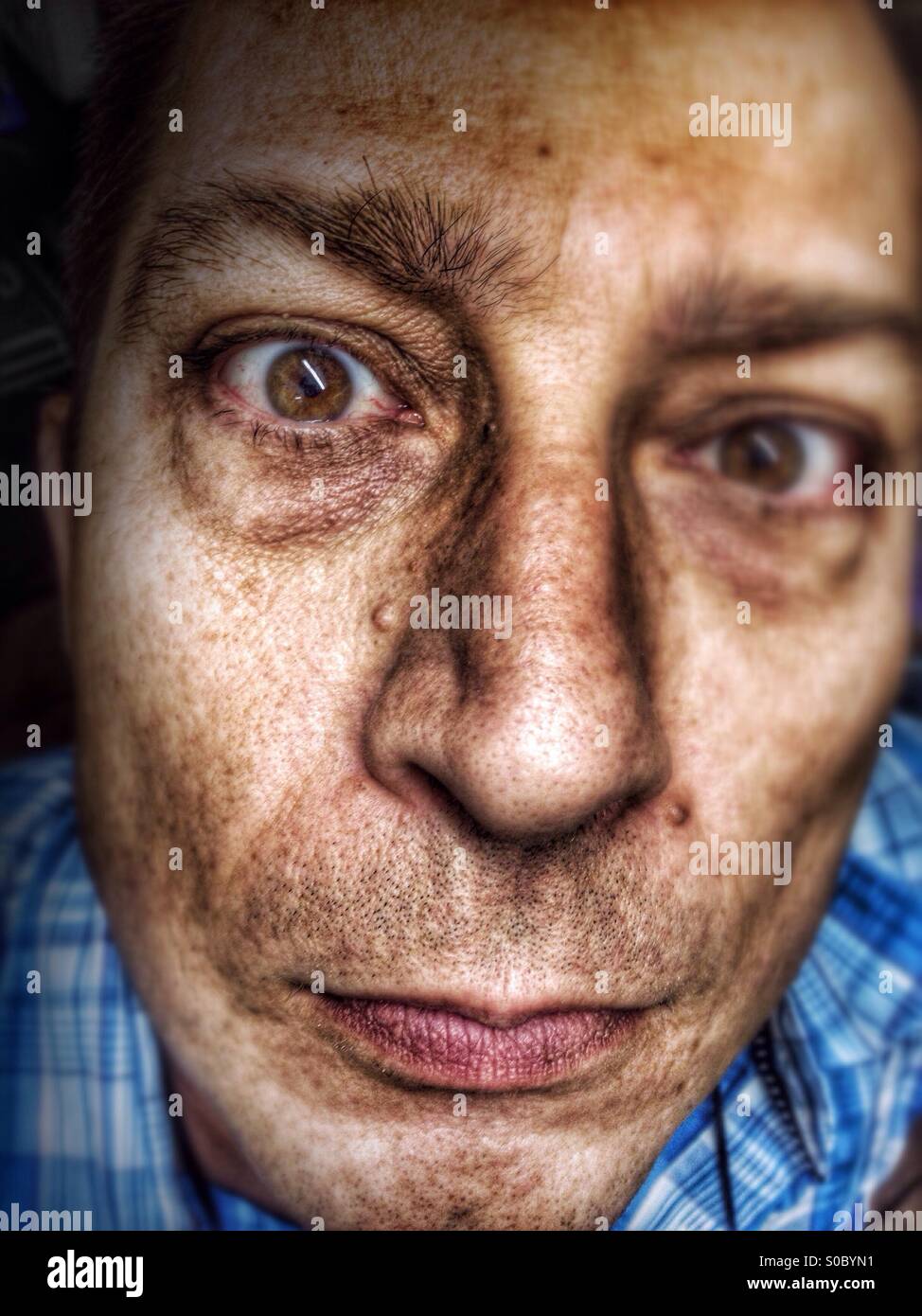 Man watching the camera Stock Photo - Alamy