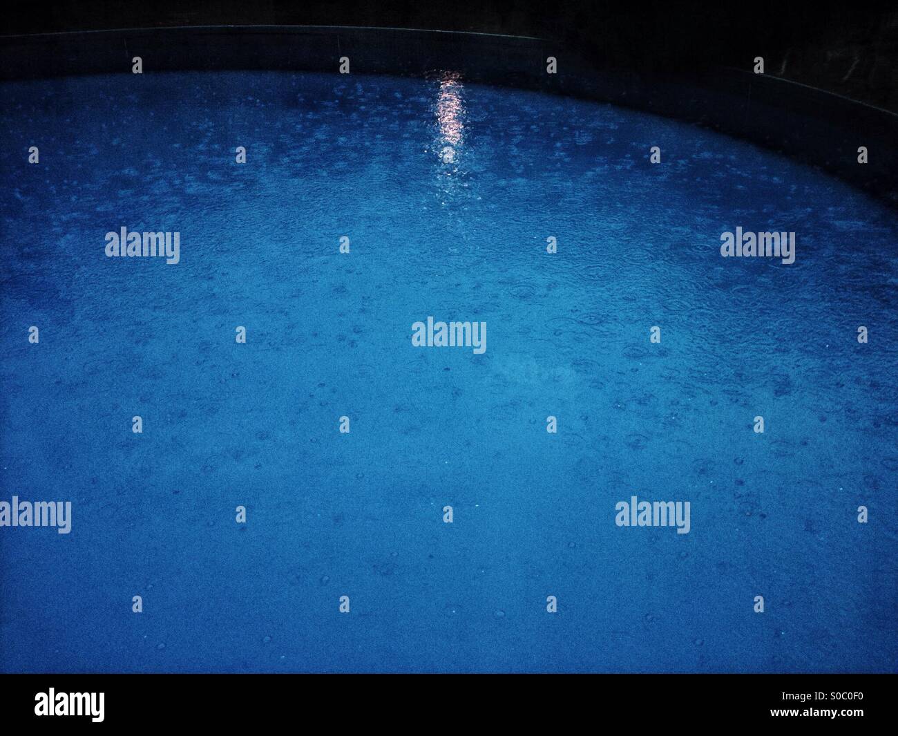 Empty swimming pool under rain Stock Photo - Alamy