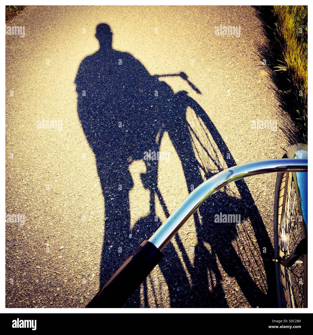 Bike rider resting on bicycle hi-res stock photography and images - Alamy