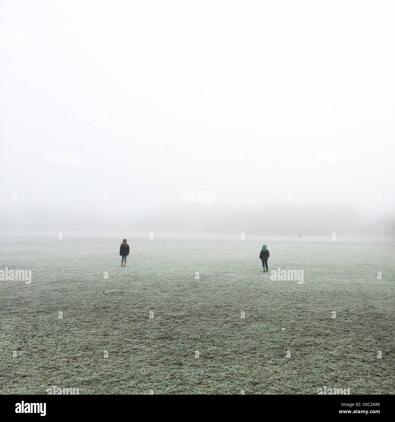 Two children walking in mist hi-res stock photography and images - Alamy