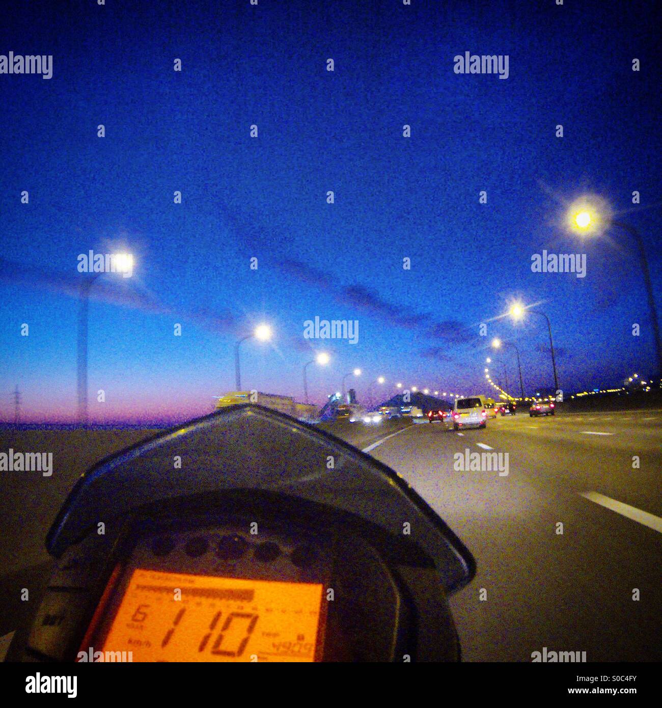 Dawn over the Highway as seen from a riding motorcycle Stock Photo - Alamy