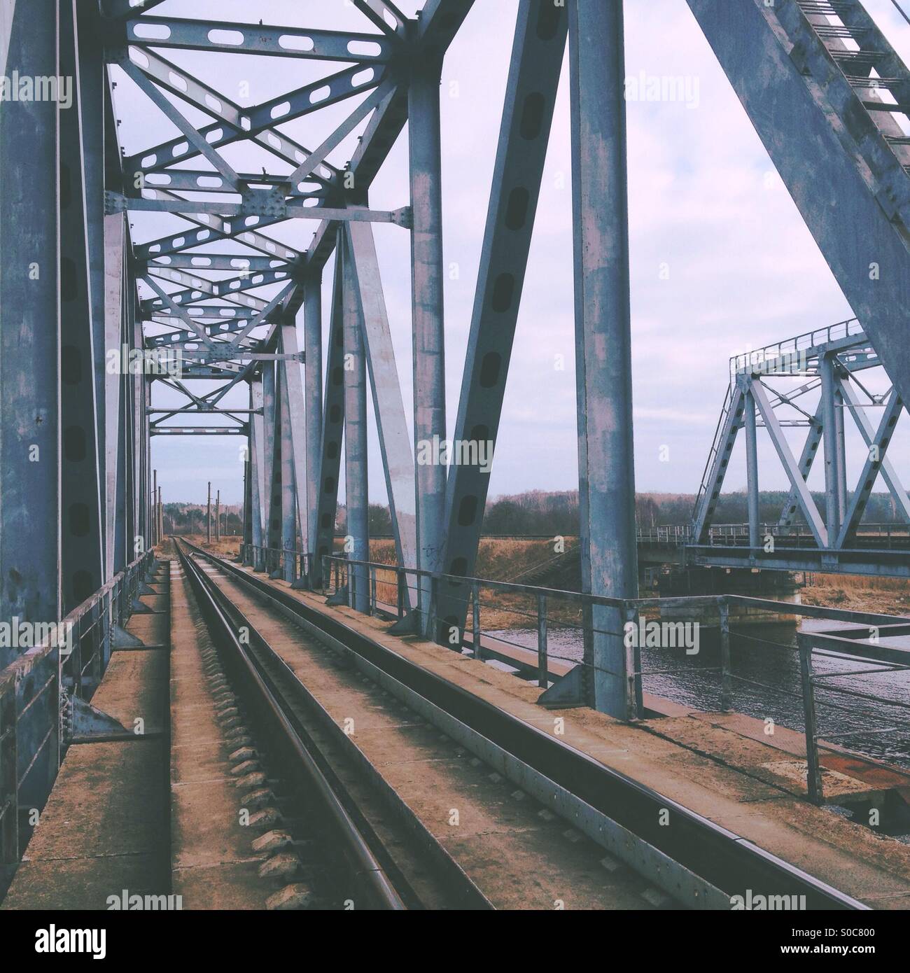 Railway steel bridge over the river Stock Photo - Alamy