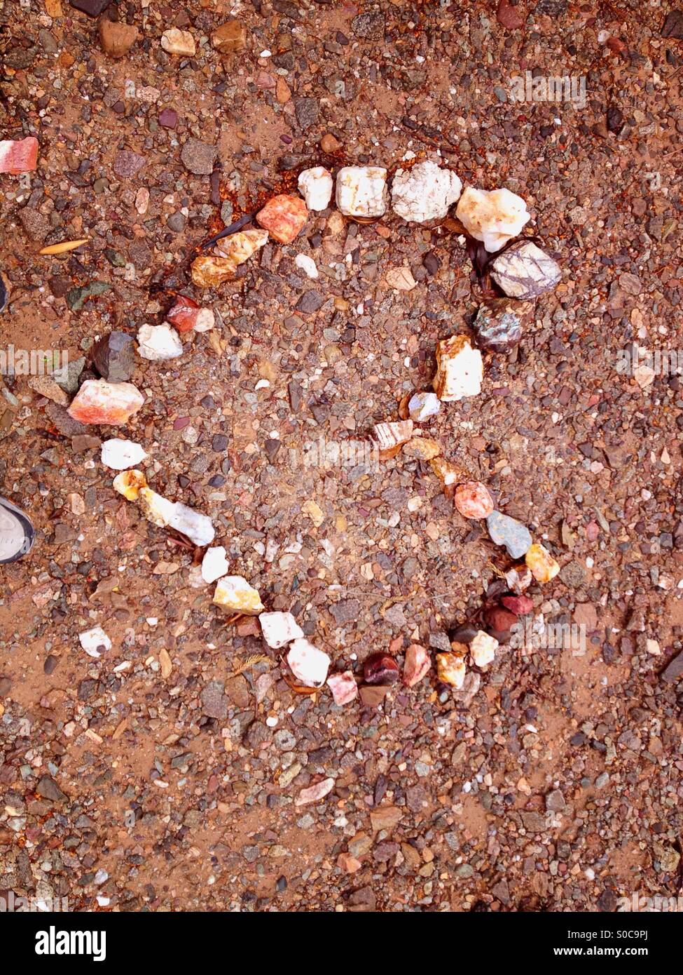 Rocks shape heart in desert Stock Photo - Alamy