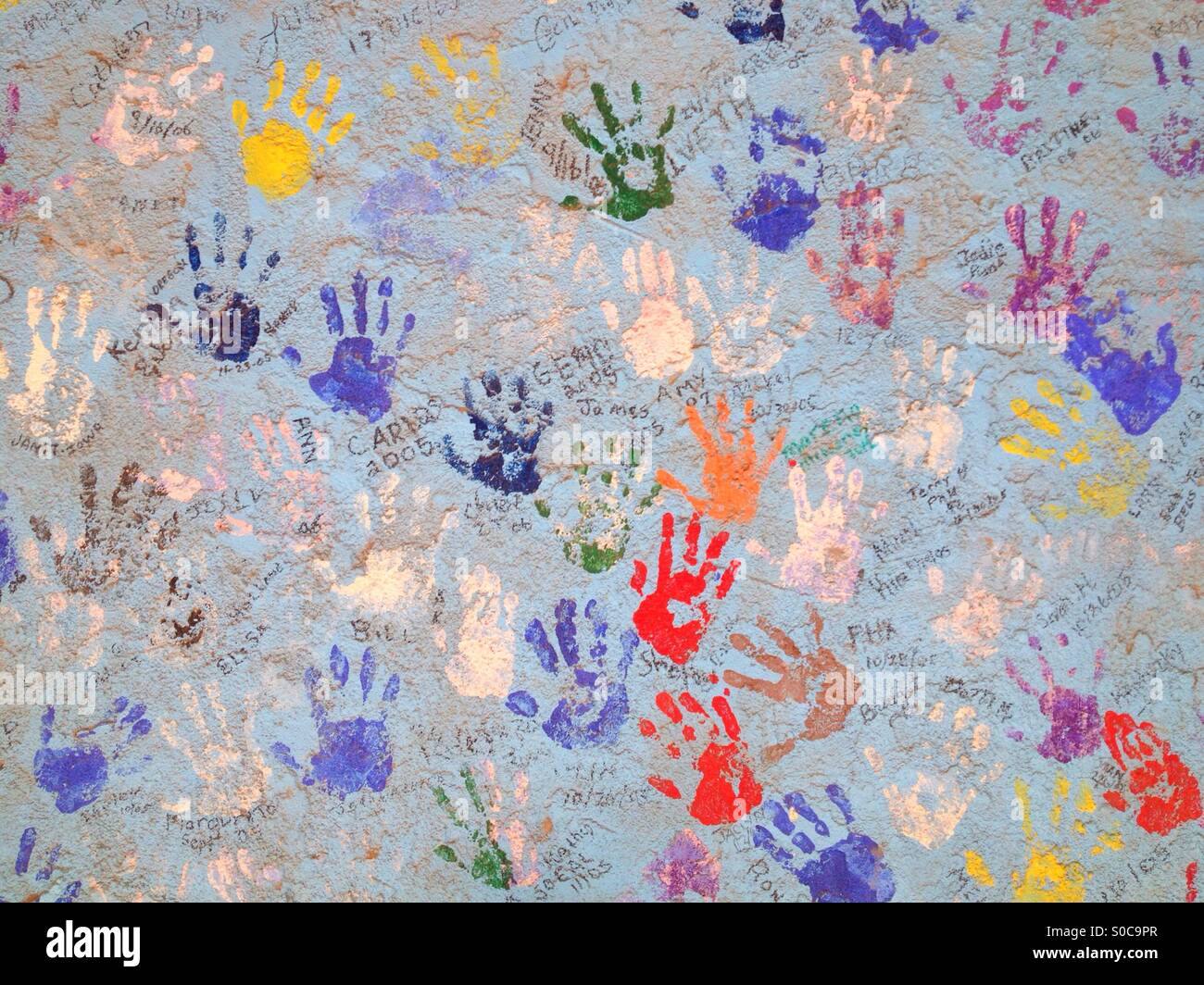 Hand prints on building wall Stock Photo - Alamy