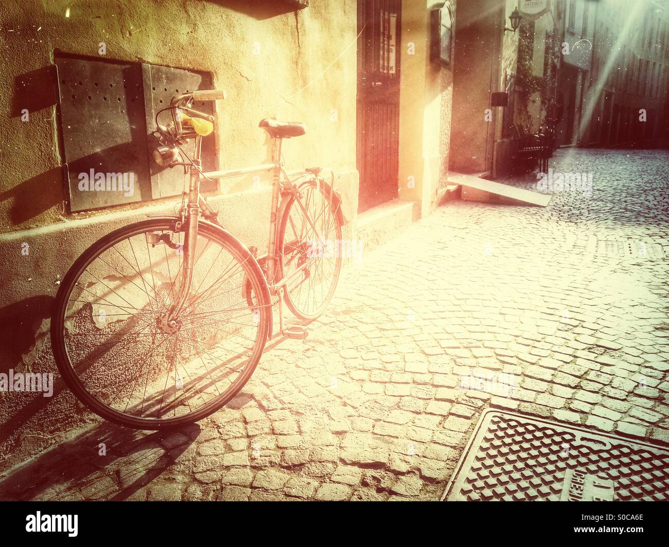 Bike in alley Stock Photo - Alamy