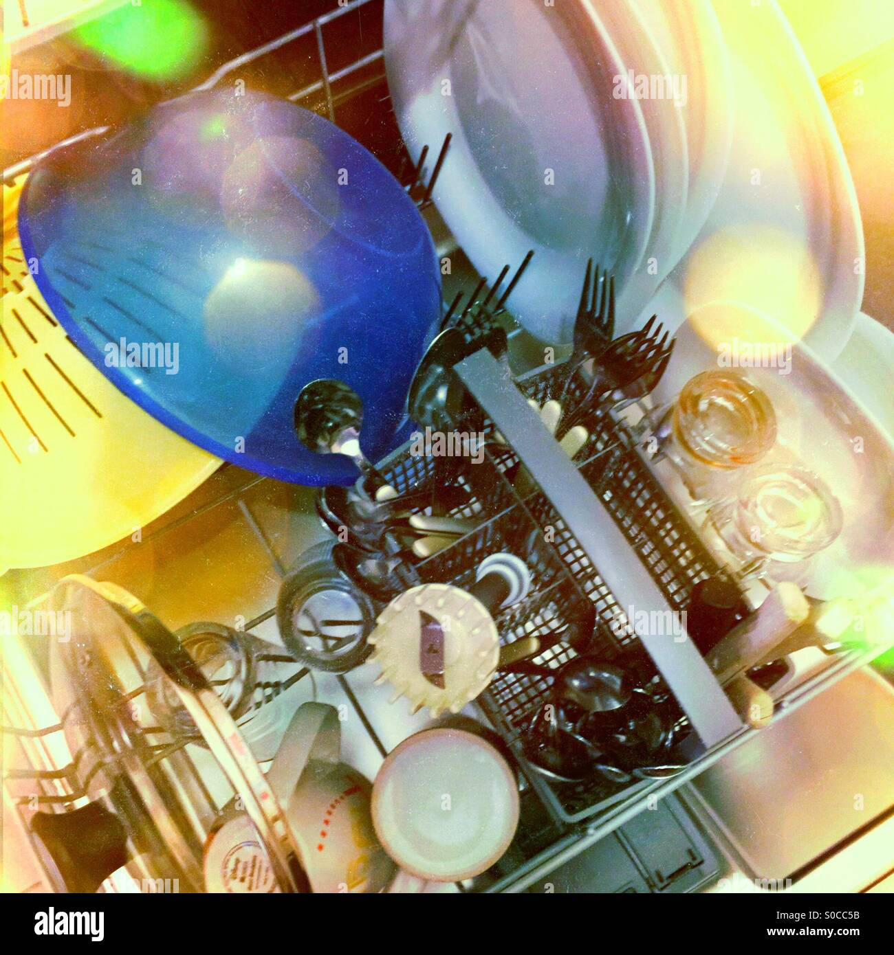 Open full dishwasher Stock Photo - Alamy