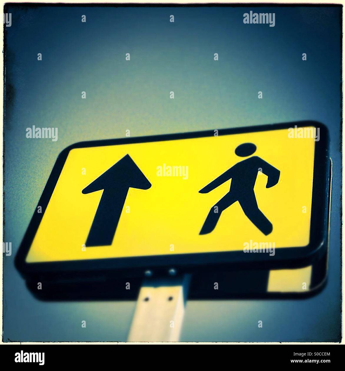Pedestrian go ahead traffic sign on blue sky Stock Photo - Alamy