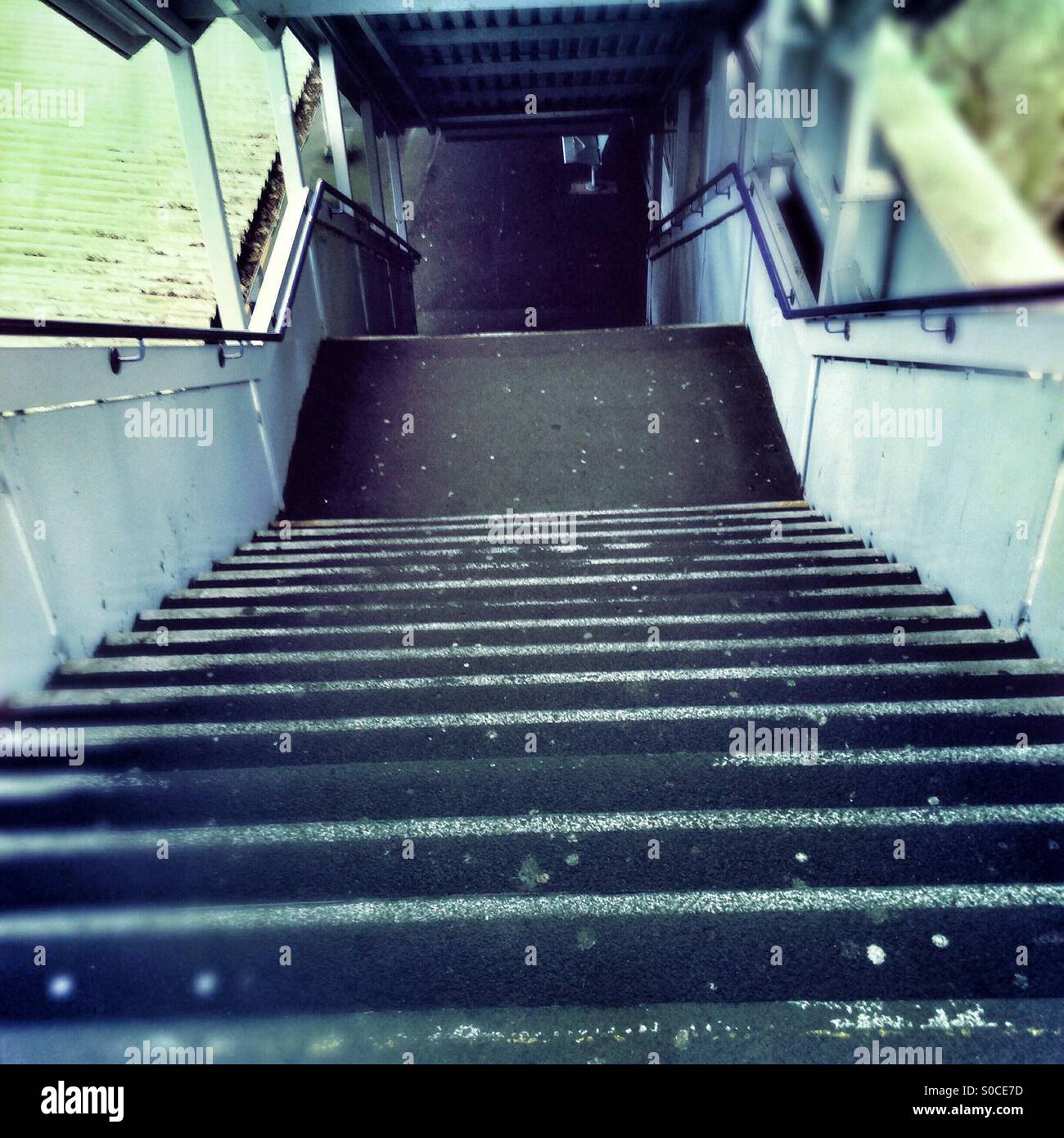 Looking down a train station staircase Stock Photo - Alamy
