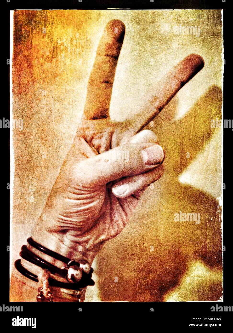 Hand victory sign Stock Photo - Alamy