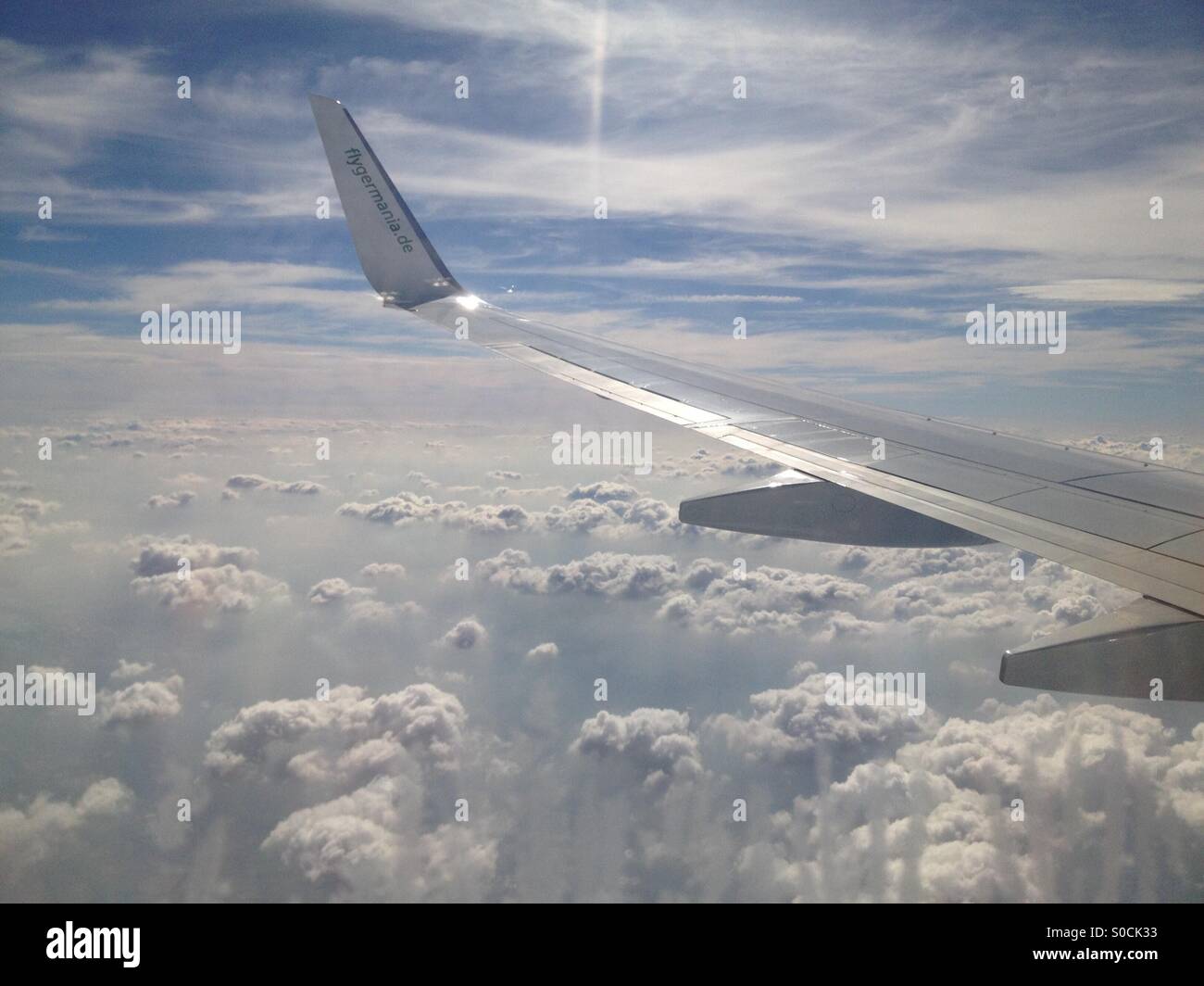 Through the plane window of the sky and clouds Stock Photo - Alamy
