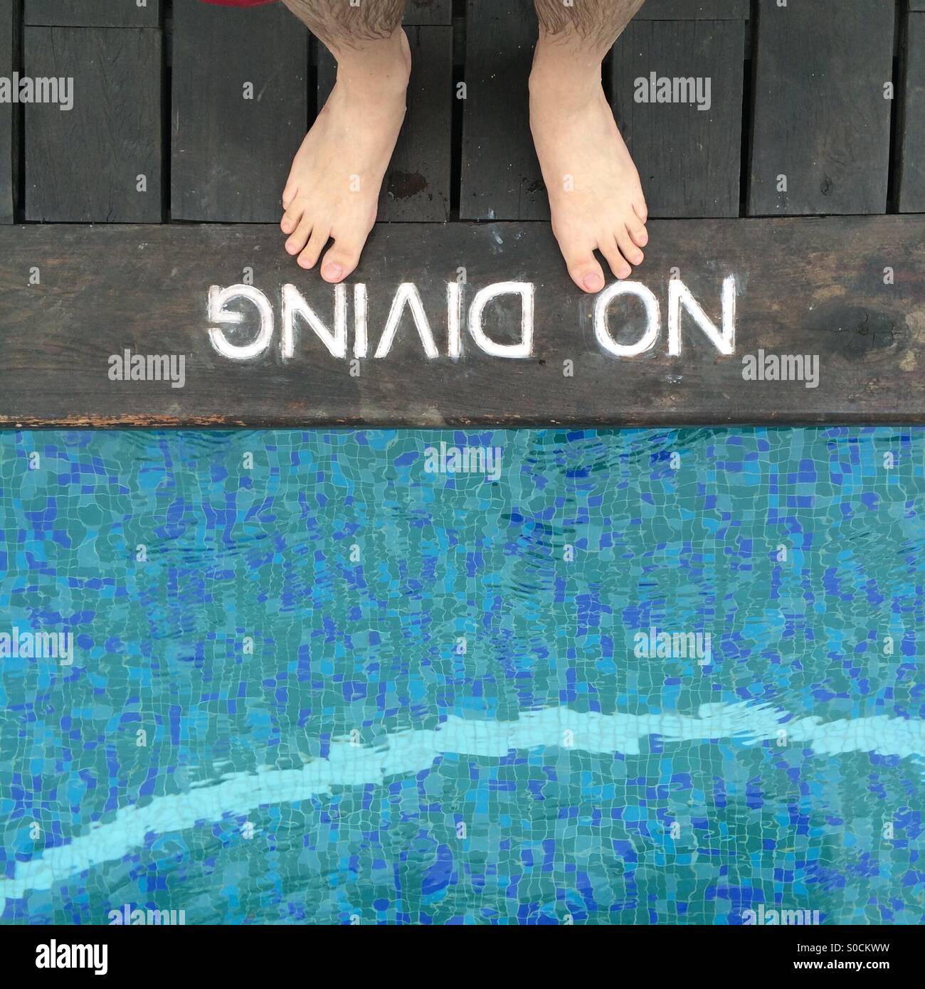 Two feet deep swimming pool edge Stock Photo - Alamy