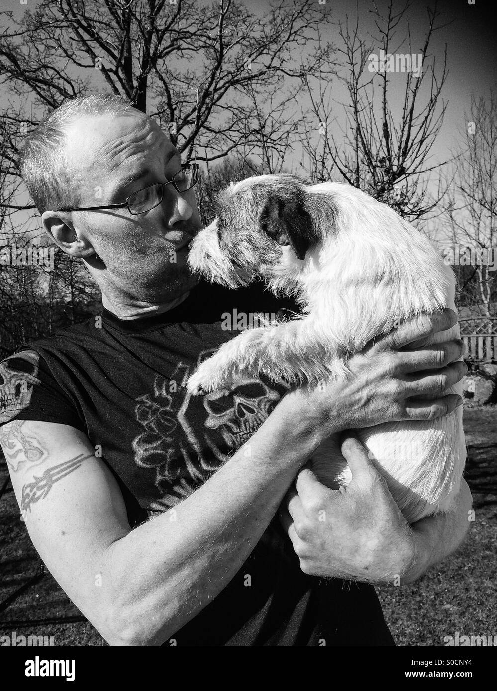 Man talking to his dog Stock Photo - Alamy