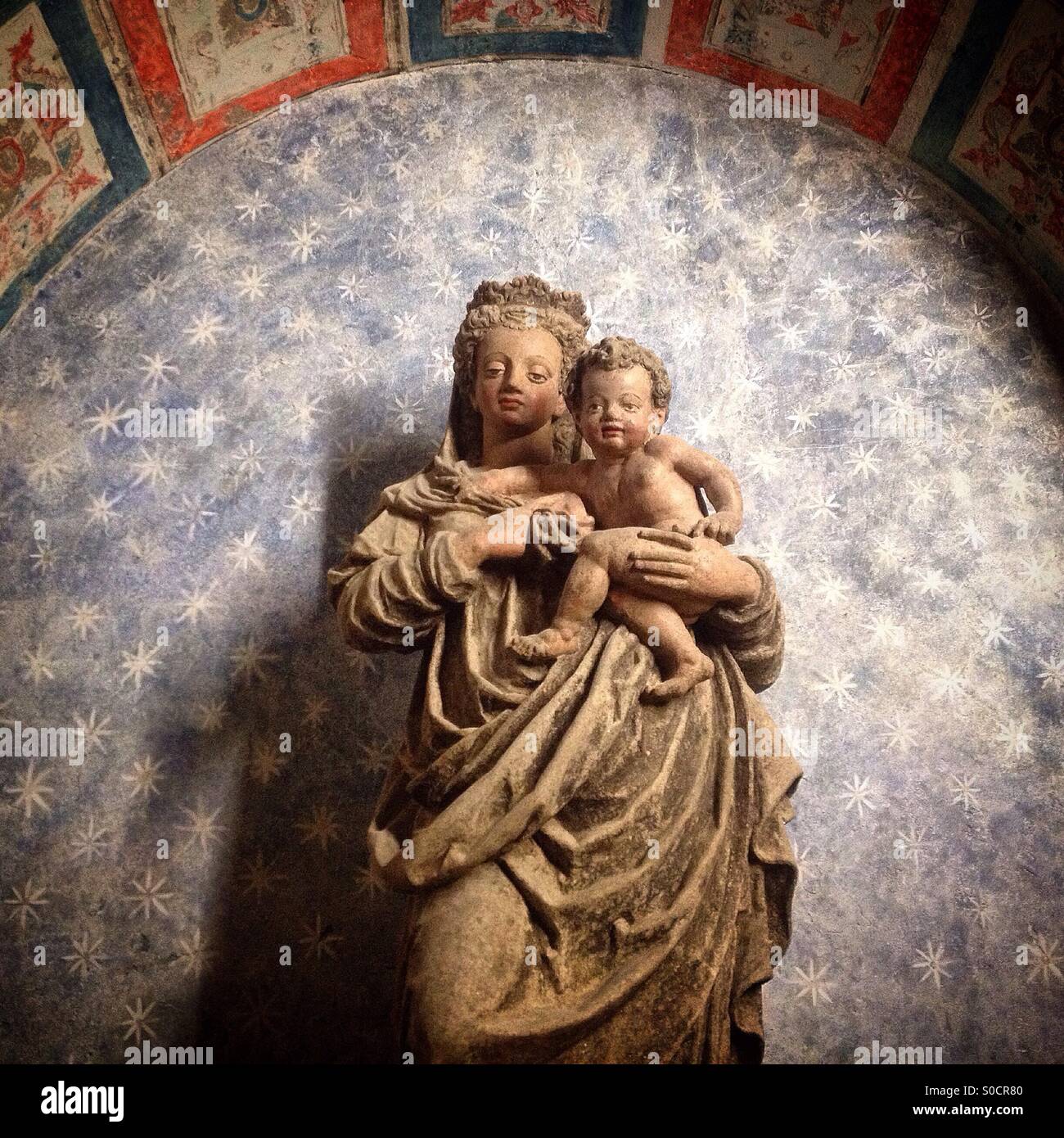 A sculpture of the Virgin Mary decorates an altar of stars in the Santa ...